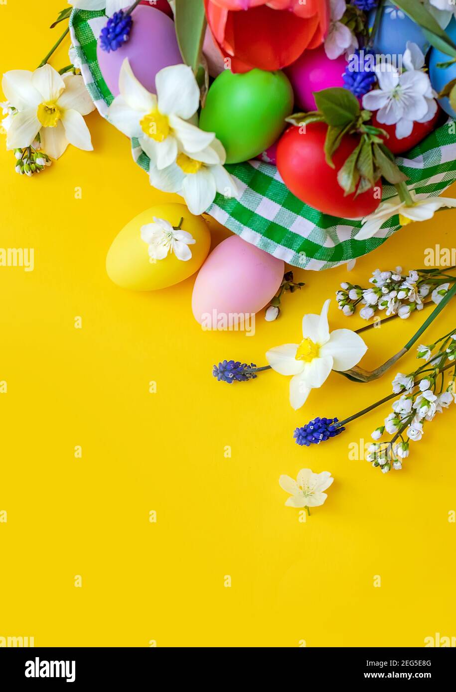 Happy Easter with flowers on a yellow background. Celebration ...