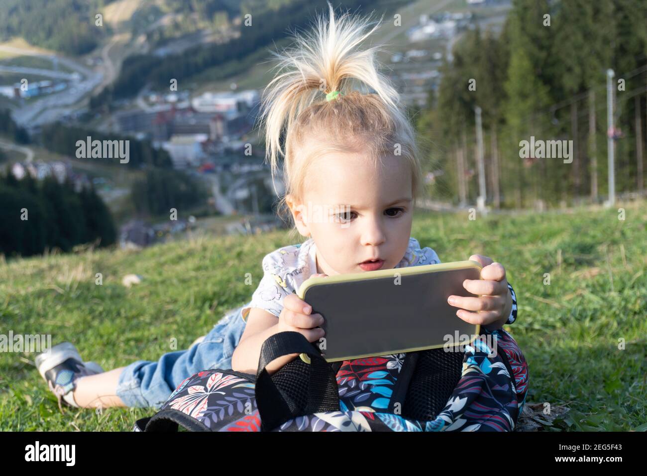 Child looking at mobile phone Stock Photo - Alamy