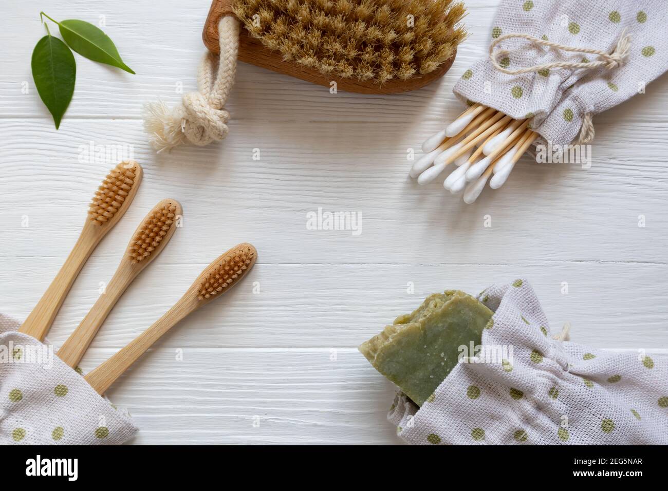 Eco-friendly personal care and home cleaning items on a white ...