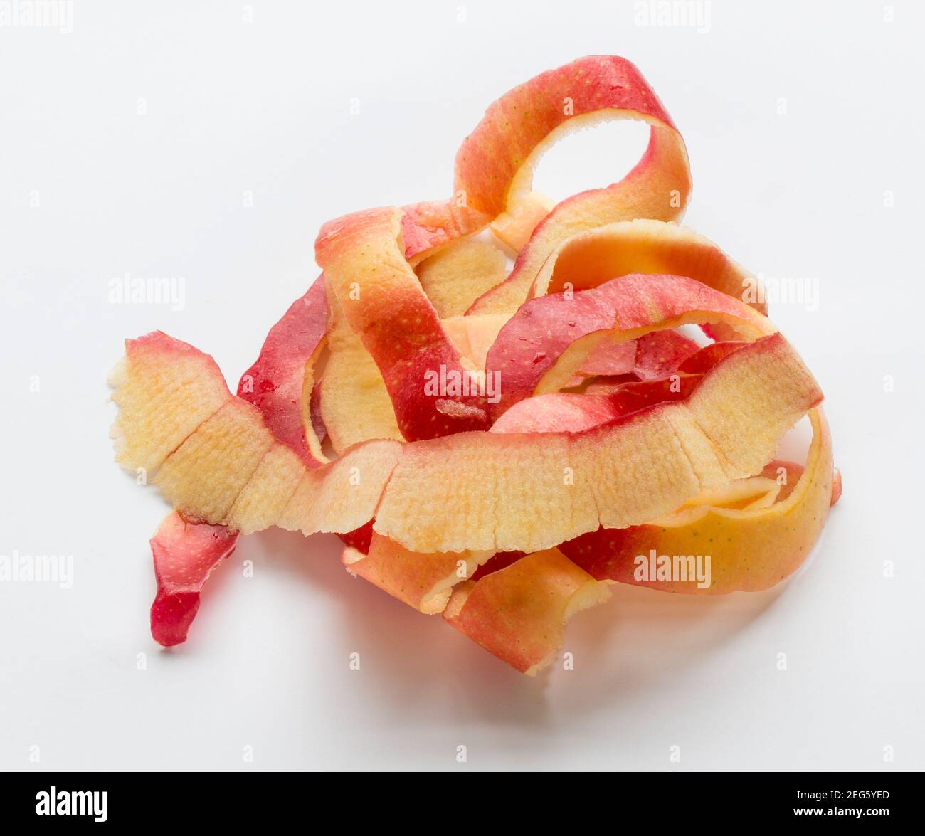 Tangled apple peelings laying on white background Stock Photo - Alamy