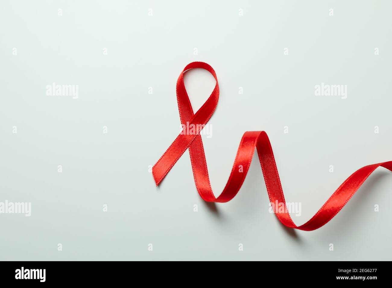Red awareness ribbon on white background, space for text Stock Photo ...