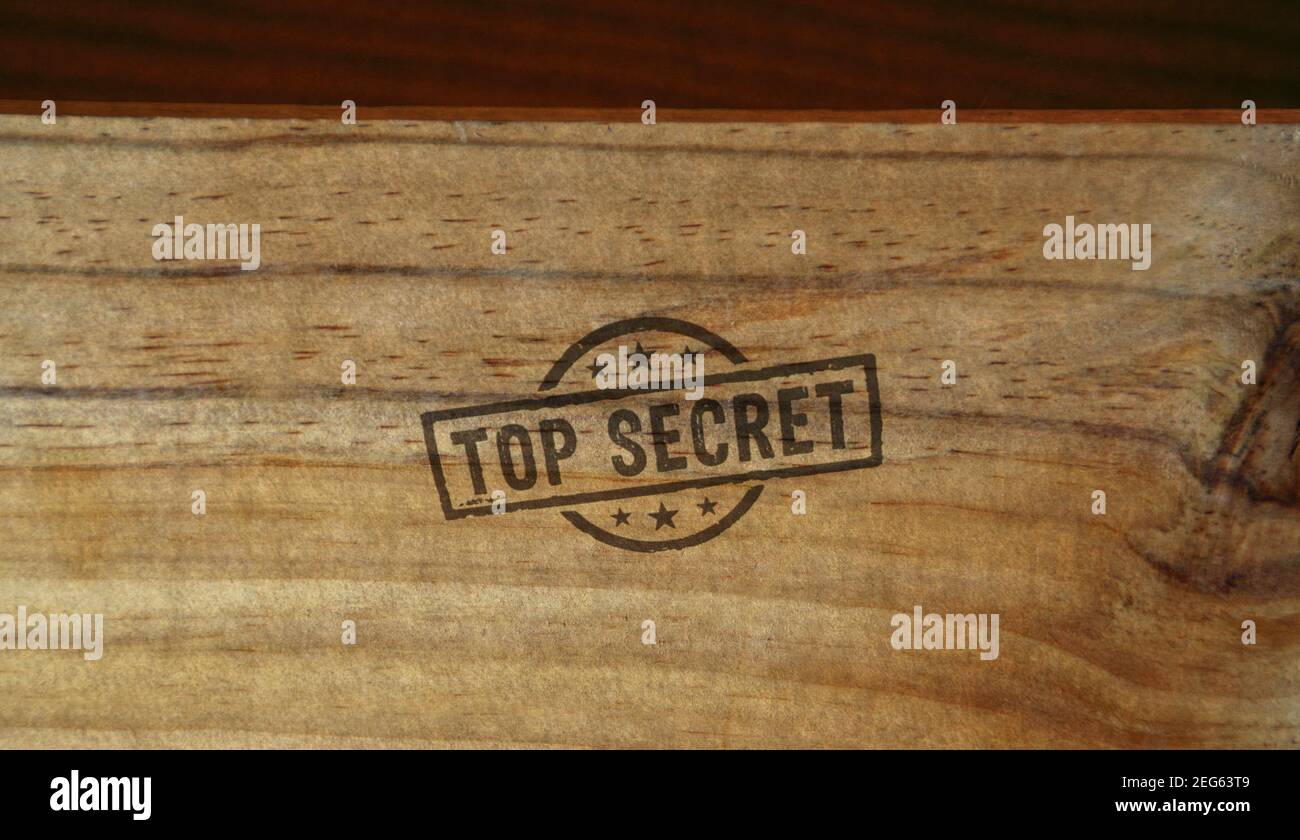 Top secret confidential stamp printed on wooden box. Government ...