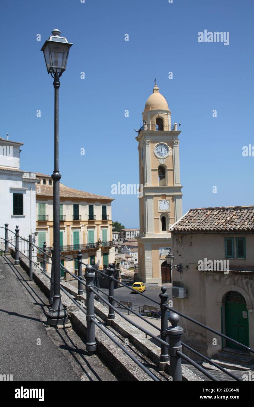 Vertical shot of a street with buildings and a tower on the side Stock ...