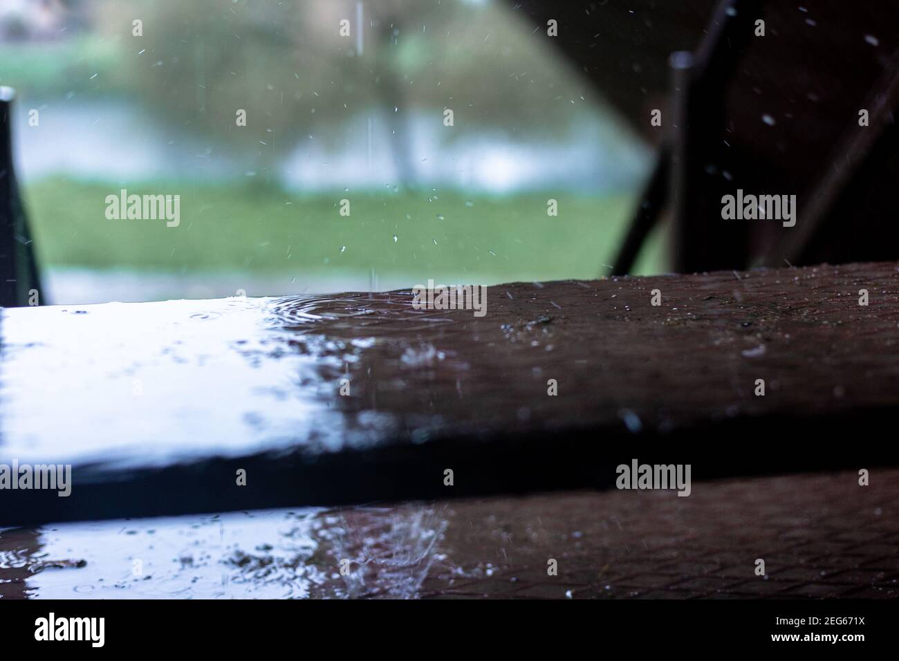 Raindrops dripping on the steps. Brown steps Stock Photo - Alamy