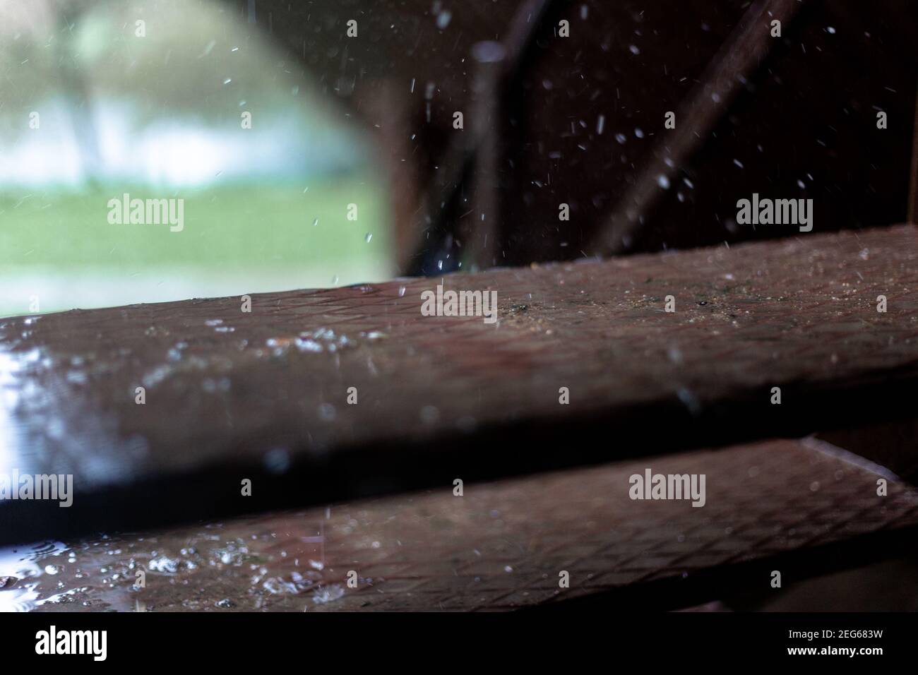 Raindrops dripping on the steps. Brown steps Stock Photo - Alamy