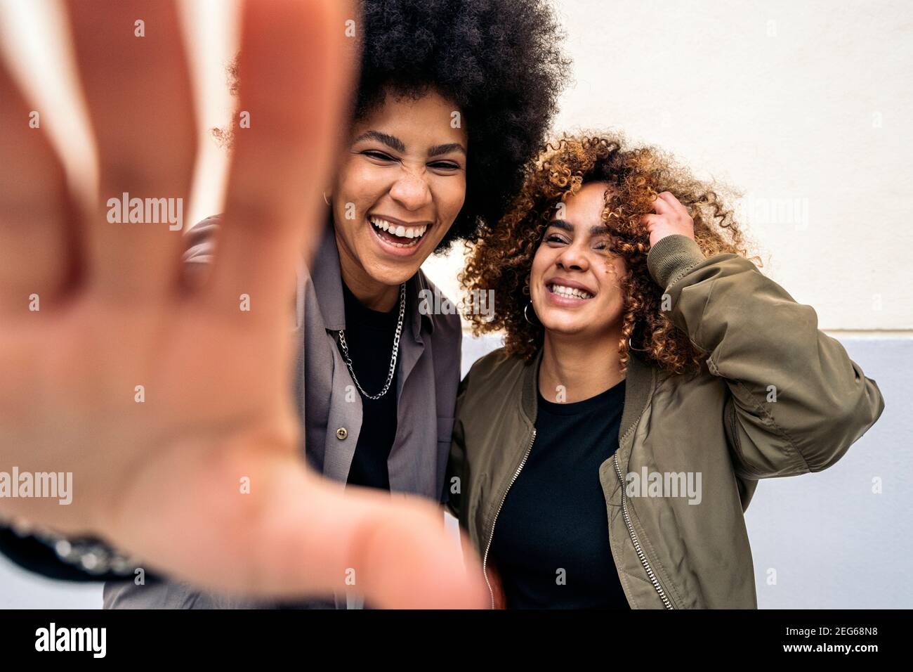 Stock photo of cool afro girls smiling and looking at camera over white ...