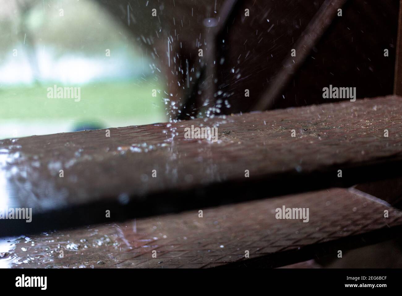 Raindrops dripping on the steps. Brown steps Stock Photo - Alamy