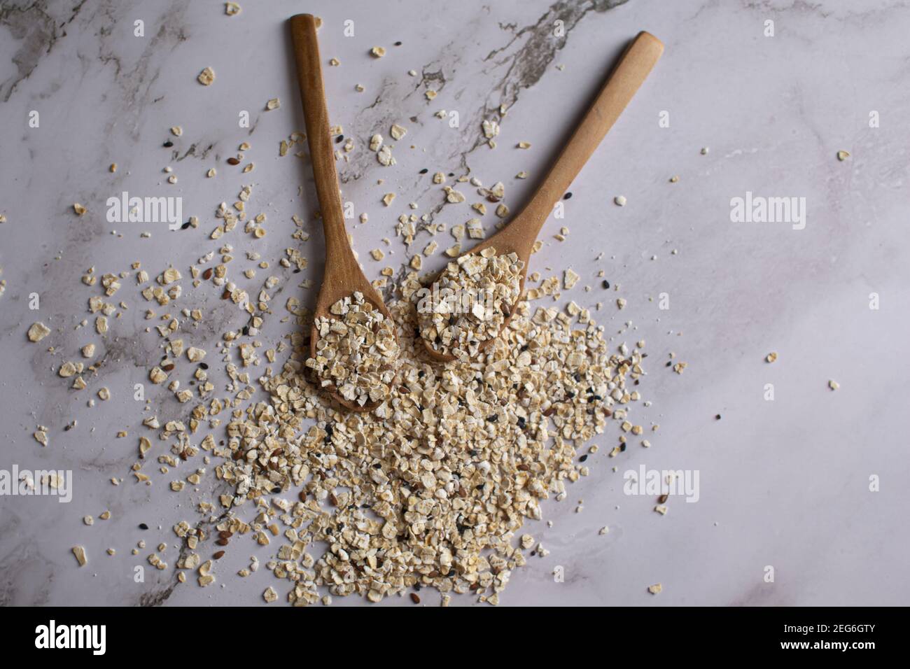 Pile of oat flakes on marble background Stock Photo - Alamy