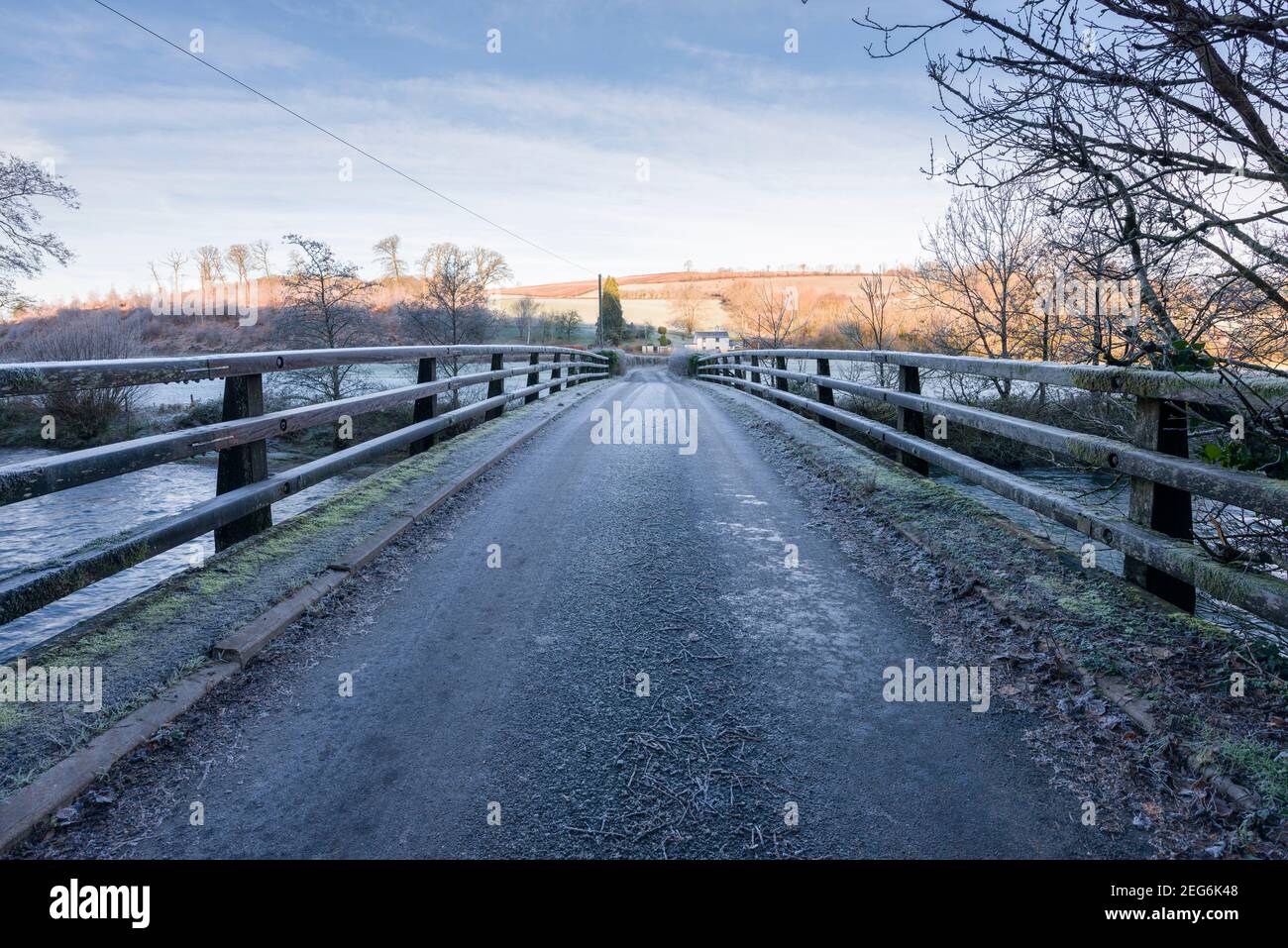 A frosty scene at Halfpenny Bridge over the River Exe in the Exe Valley ...