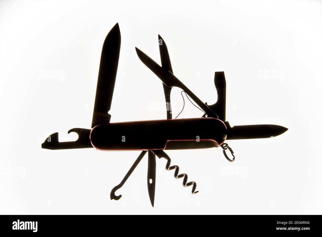 Swiss knife. Multi-tool displayed against a light background showcasing ...