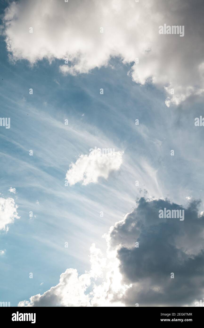 Surreal sun rays are striking through the clouds like an explosion ...