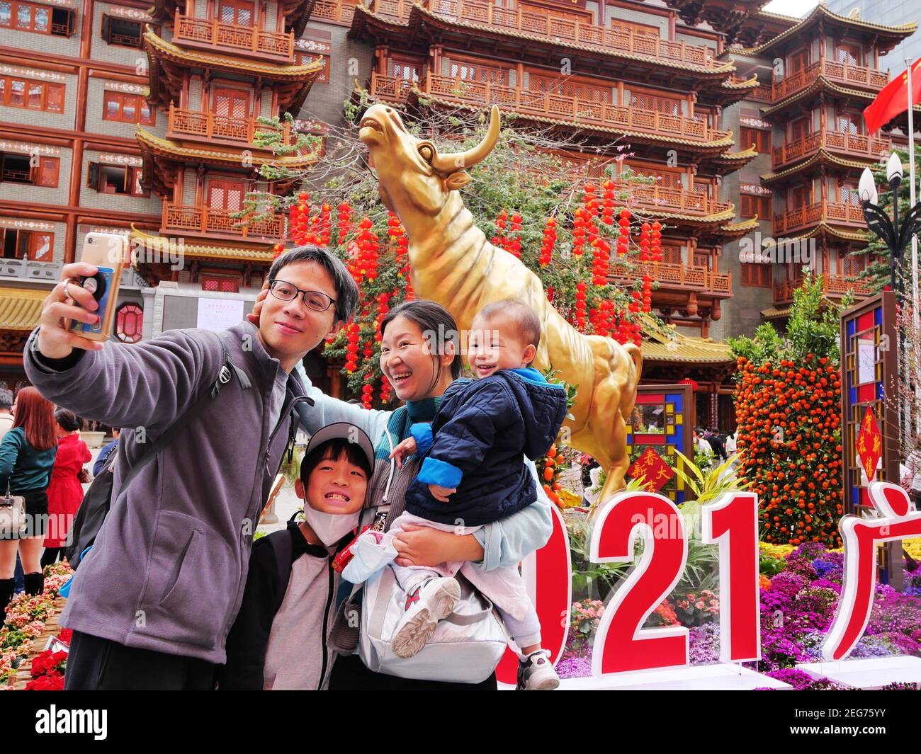 A sculpture of gold ox replaces the flower market to welcome the Spring ...