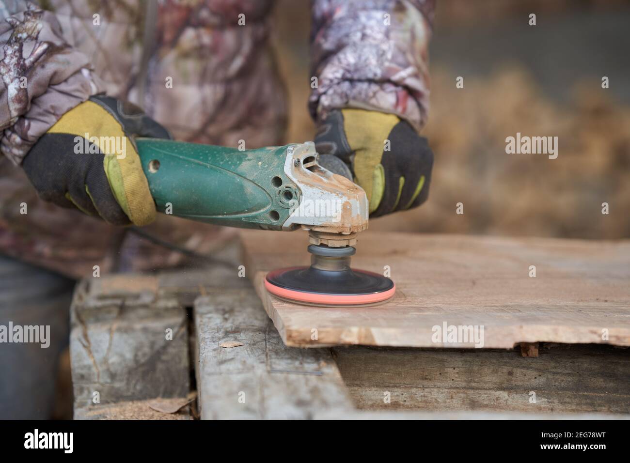 Carpenter sanding a walnut wood board in his workshop Stock Photo - Alamy