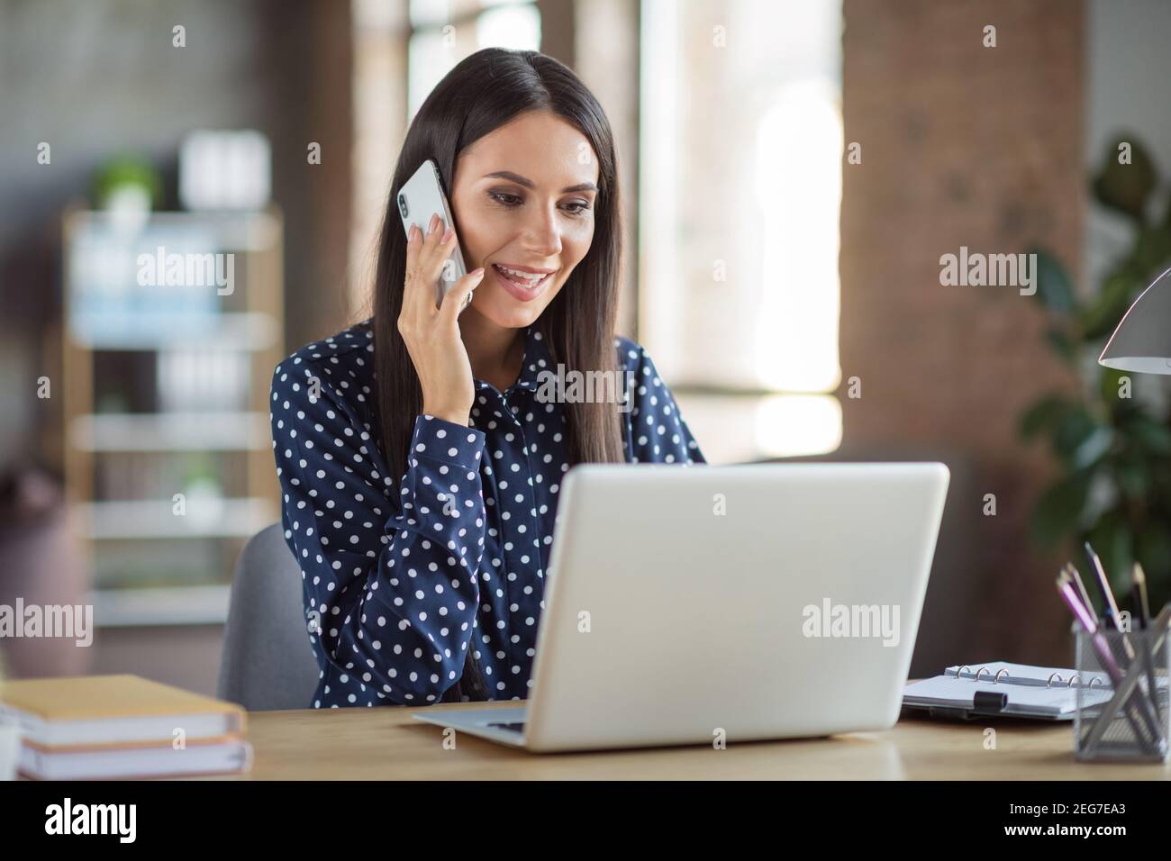 Photo of young attractive beautiful focused businesswoman typing in ...