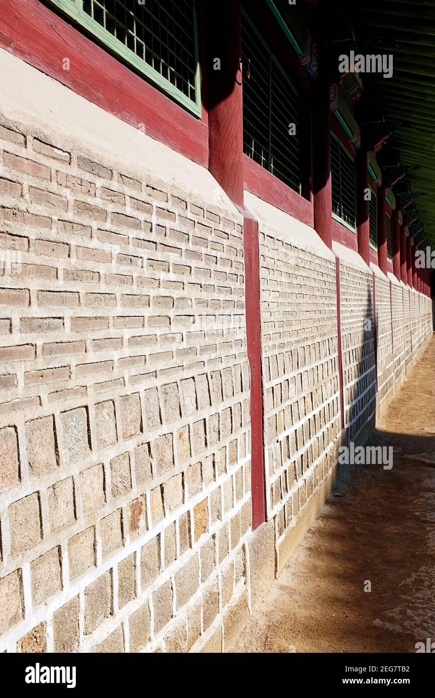 Ancient brick wall extending into the distance. Vertical composition ...