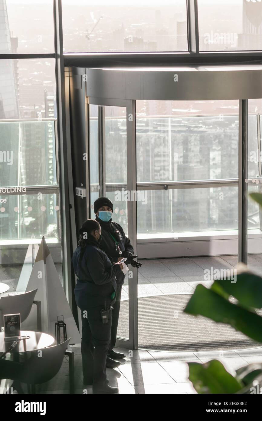 London, UK- 15 Dec 2020: Security guards in Sky Garden terrace at work ...