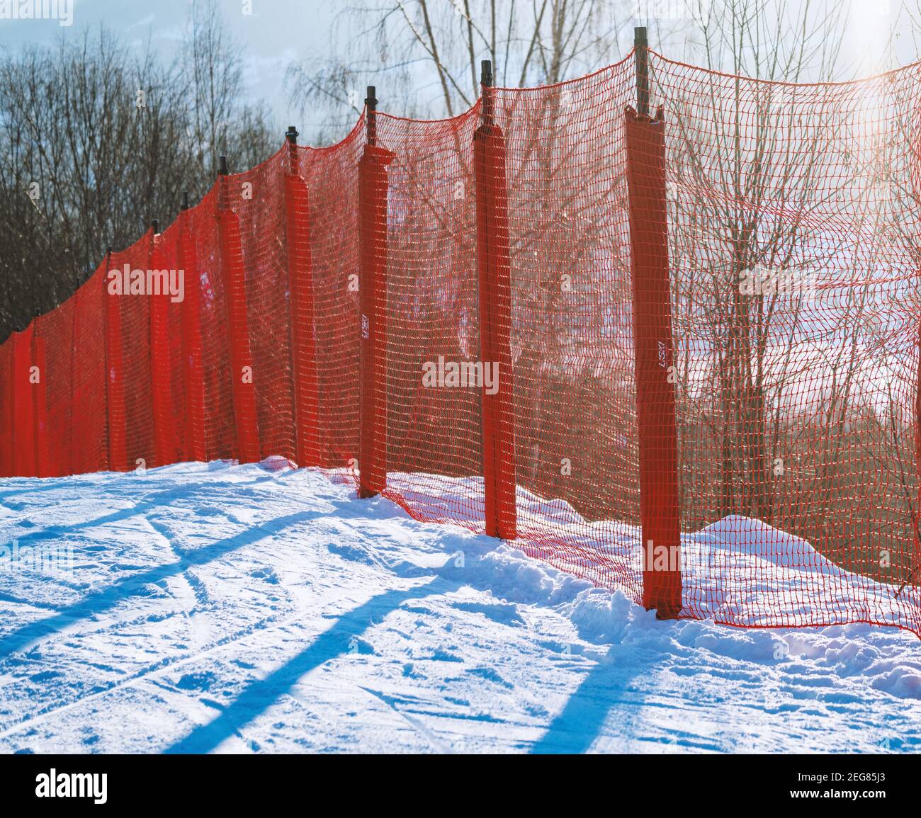 Red safety net at the edge of an alpine skiing slope Stock Photo - Alamy