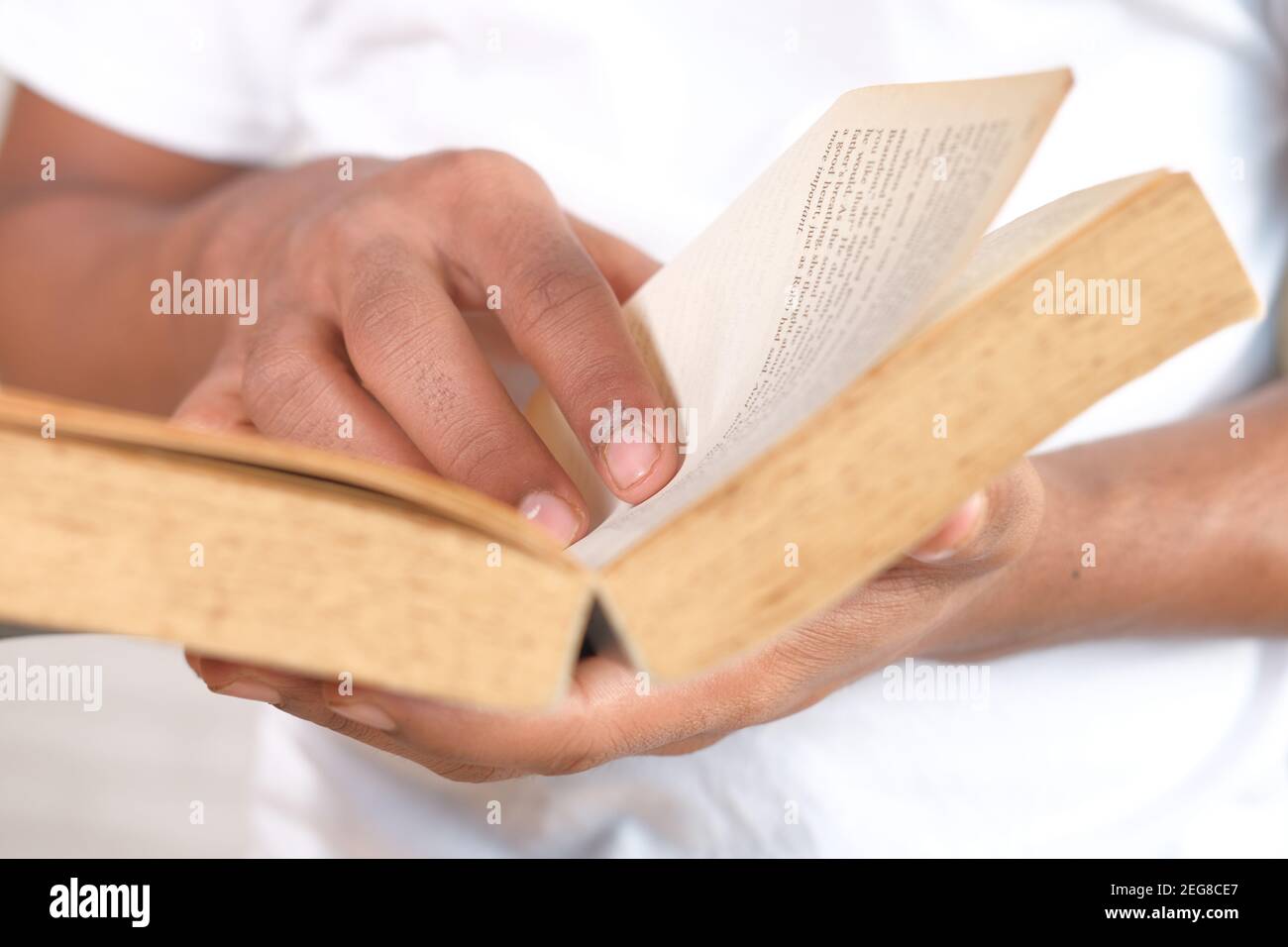 Book hand black close up hi-res stock photography and images - Alamy