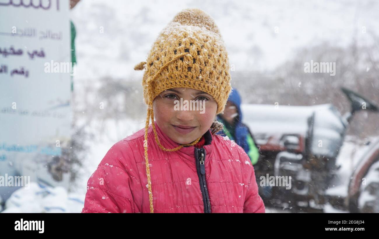 Poor Syrian Refugee Girl Portrait Looking at the Camera in Snow Weather ...