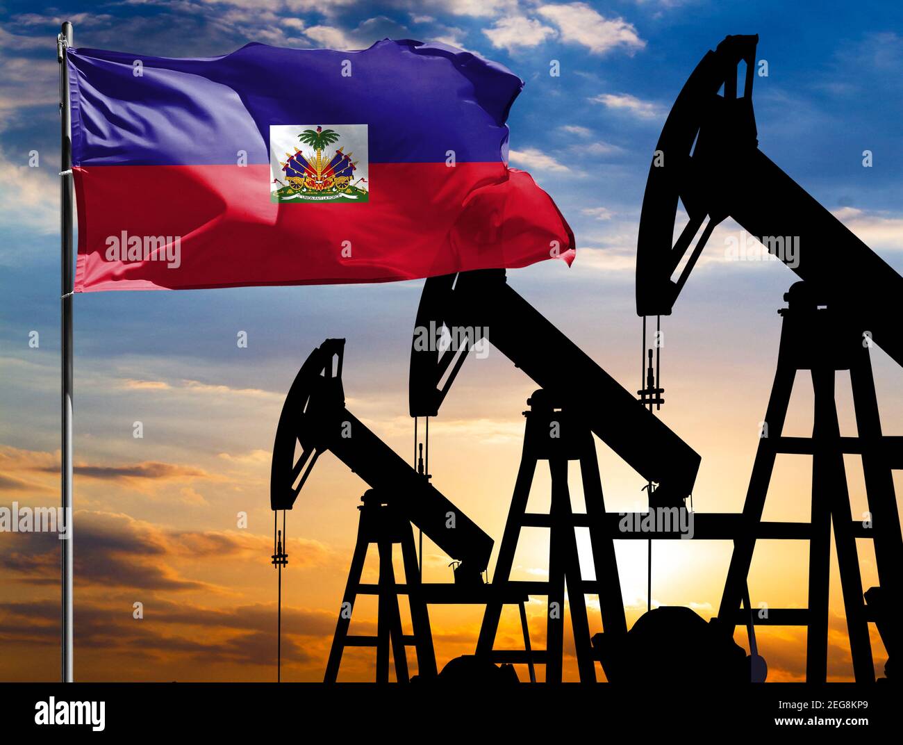 Oil rigs against the backdrop of the colorful sky and a flagpole with ...