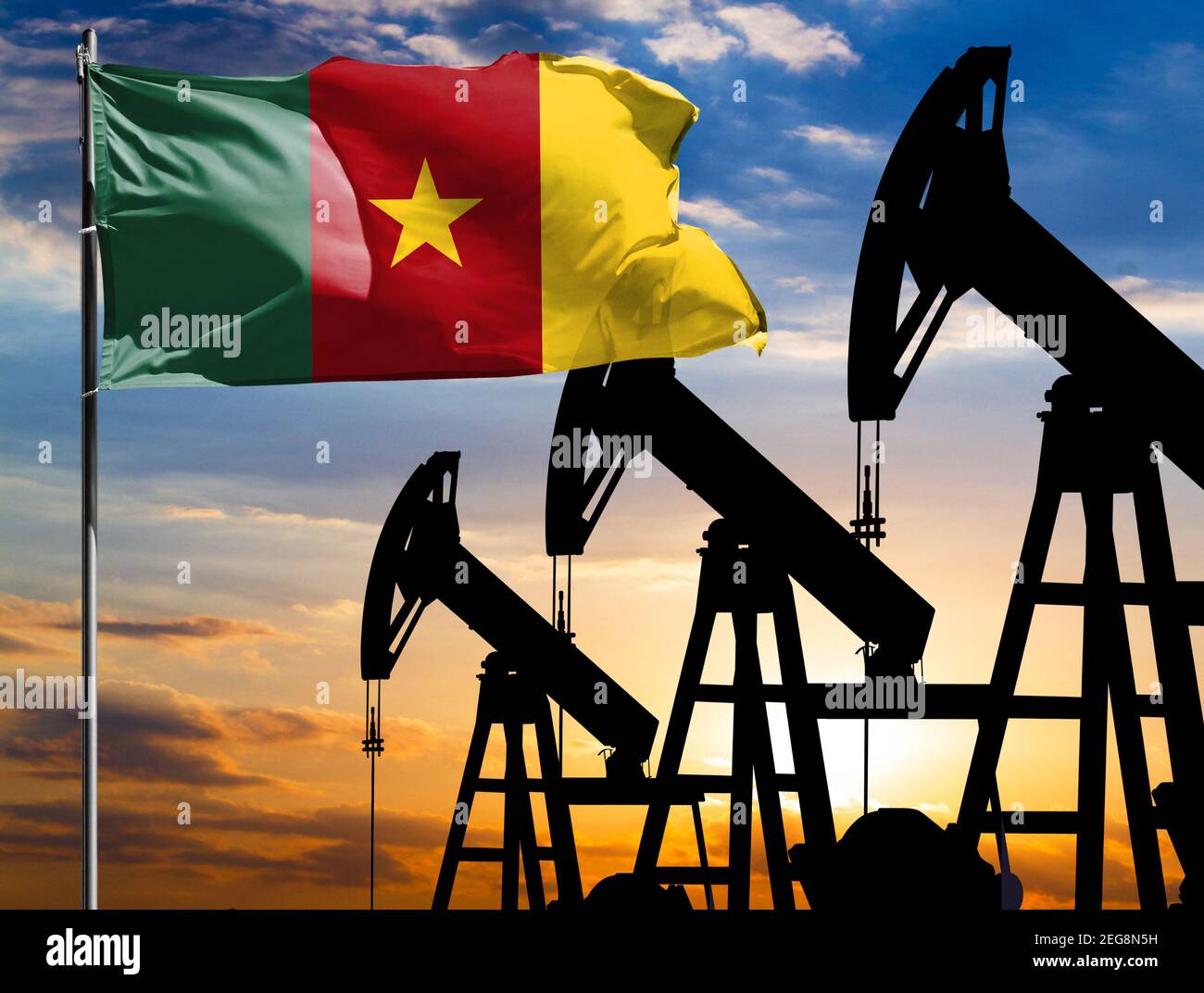 Oil rigs against the backdrop of the colorful sky and a flagpole with ...