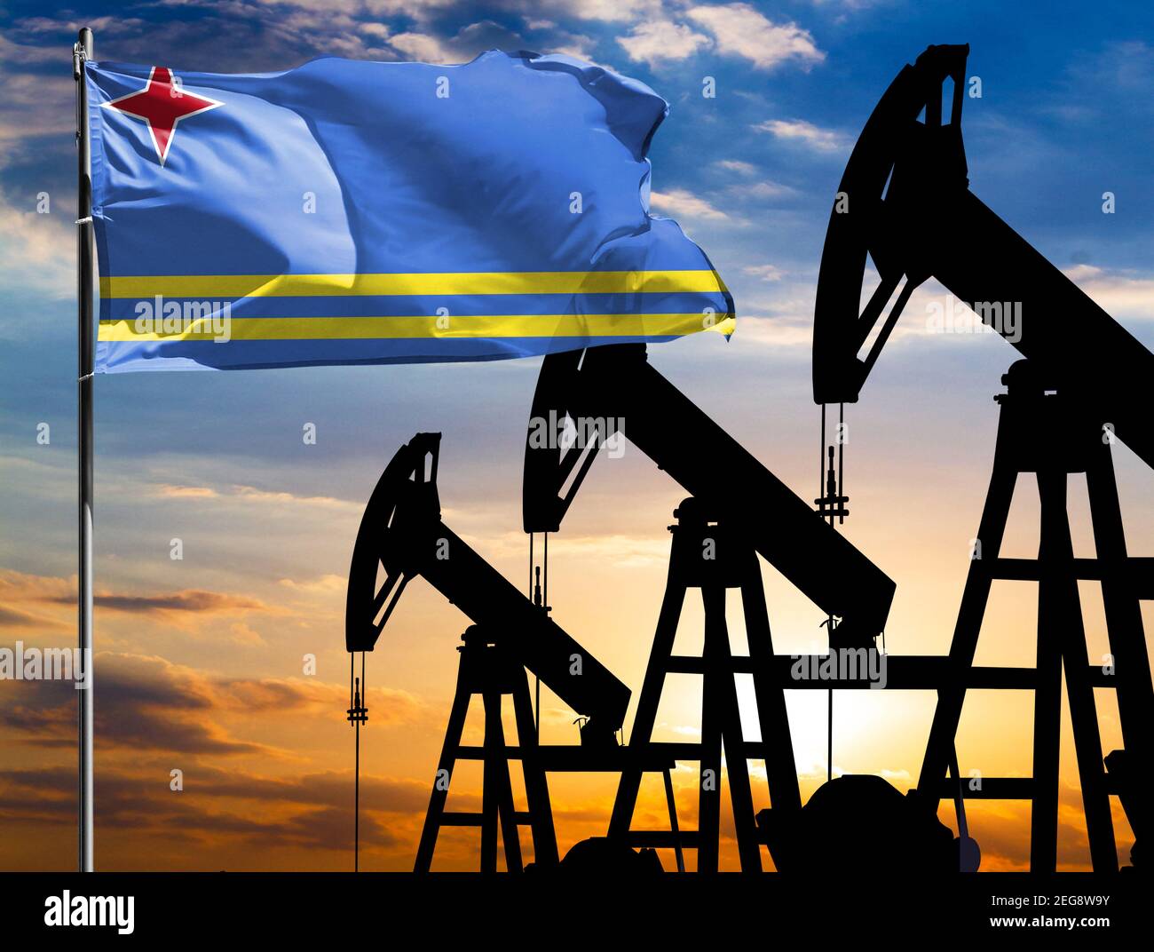 Oil rigs against the backdrop of the colorful sky and a flagpole with ...