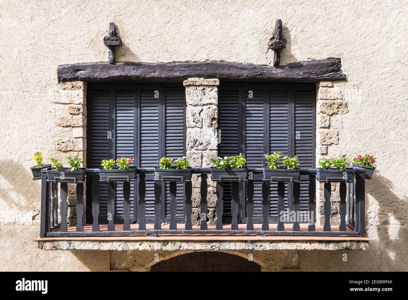 Old-style balcony with French shutters Stock Photo - Alamy