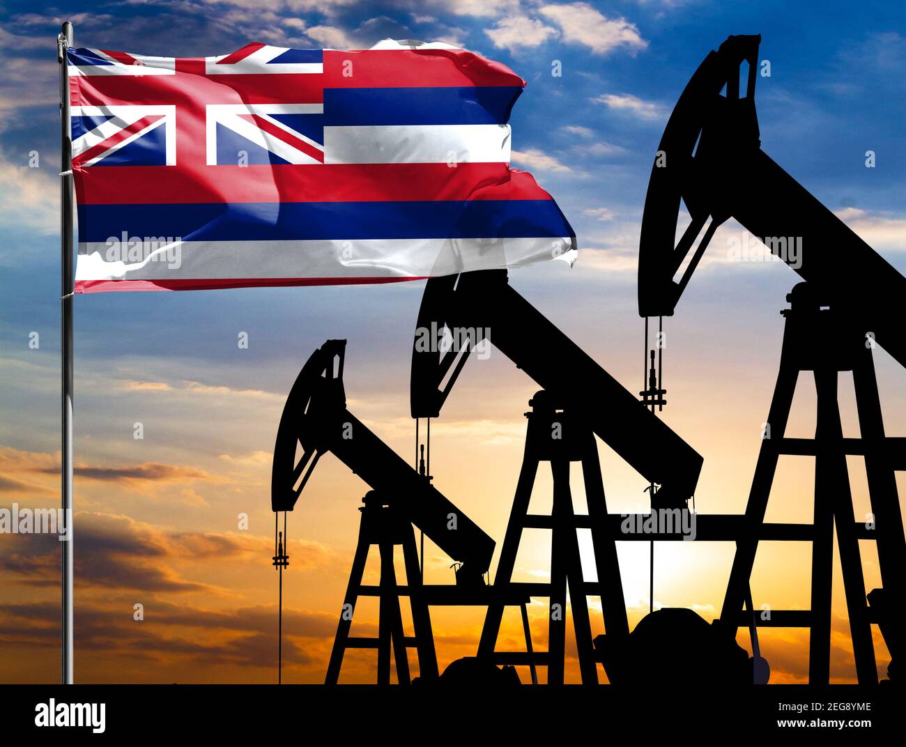 Oil rigs against the backdrop of the colorful sky and a flagpole with ...