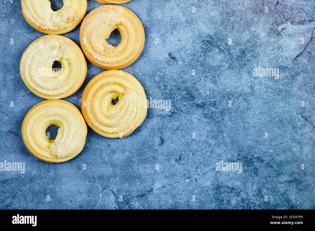 Bunch of biscuits on a blue background Stock Photo - Alamy