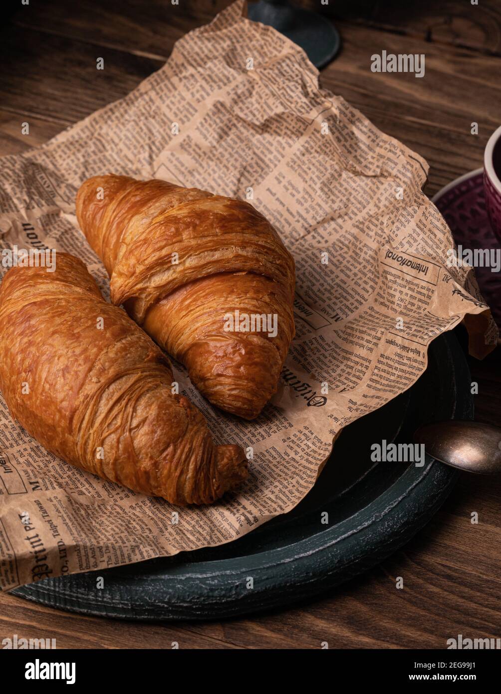 Freshly baked croissants for breakfast on the old paper rustic ...