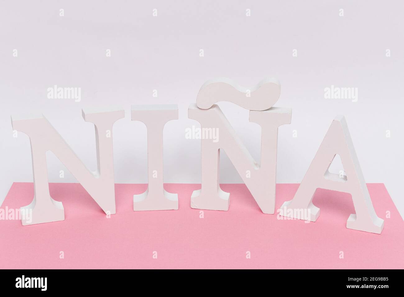 Colorful background with Spanish "NINA" writing Stock Photo - Alamy