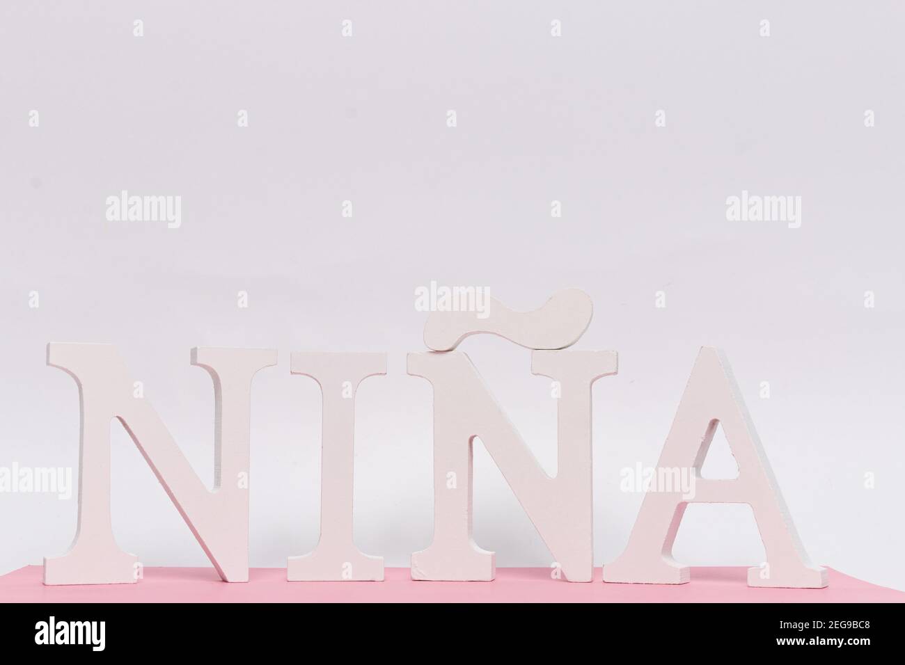 Colorful background with Spanish "NINA" writing Stock Photo - Alamy