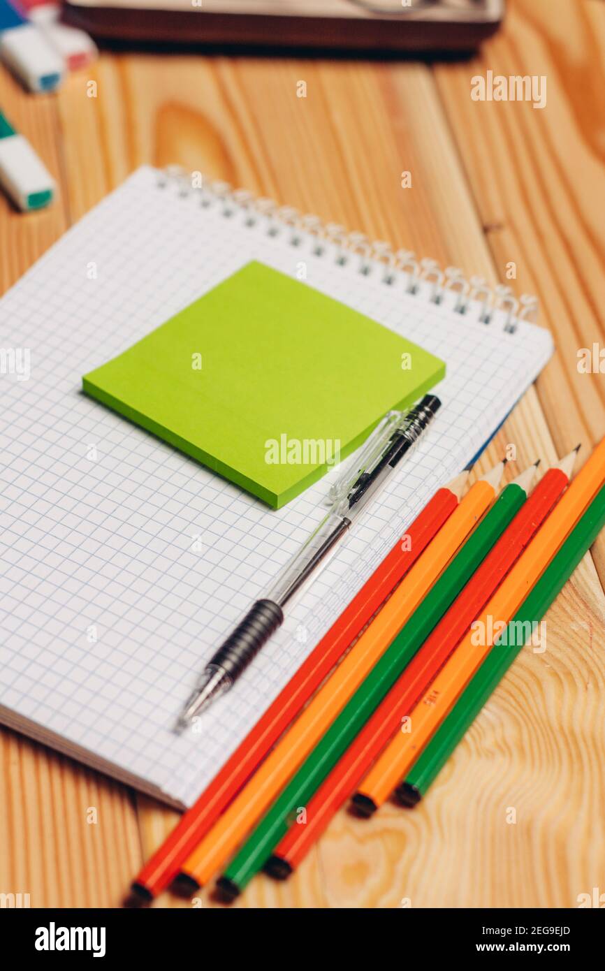 notepads pencils office work paper wood background Stock Photo - Alamy