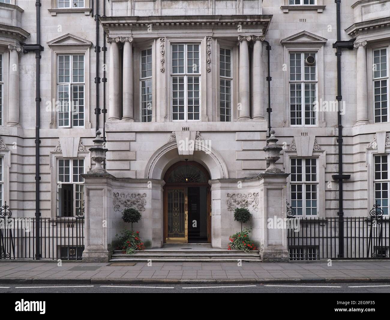 Old stone apartment building with classical style design features Stock ...