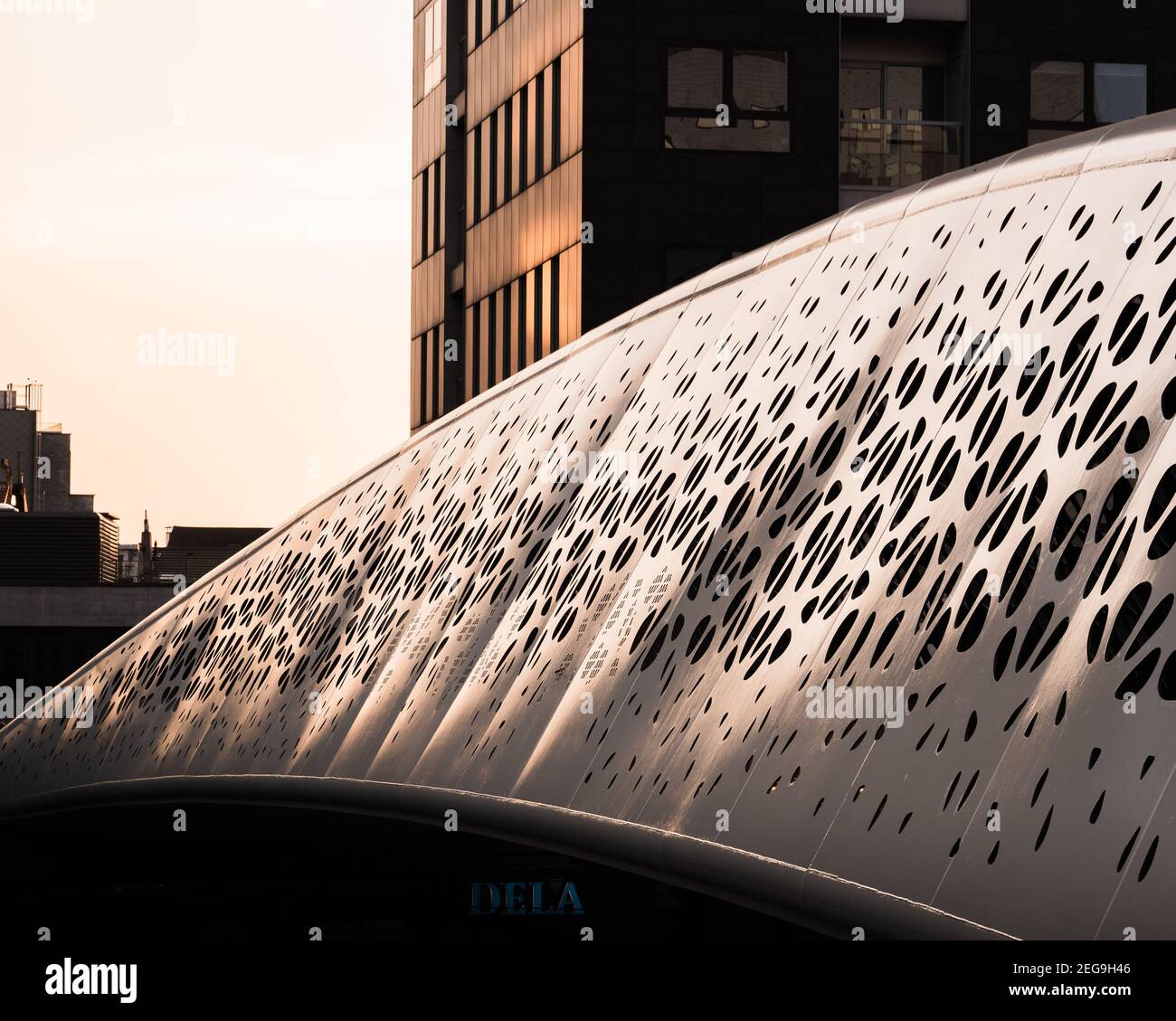 Abstract metal structure with holes in a city Stock Photo - Alamy