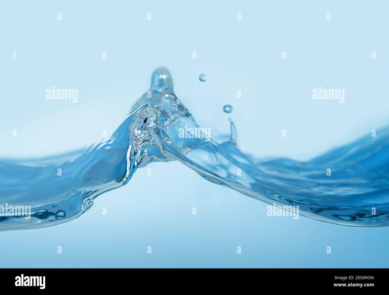 Side view of blue water waves and splashes Stock Photo - Alamy
