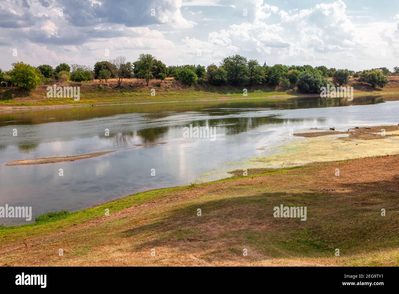 Summer riverside with islets in the water Stock Photo - Alamy