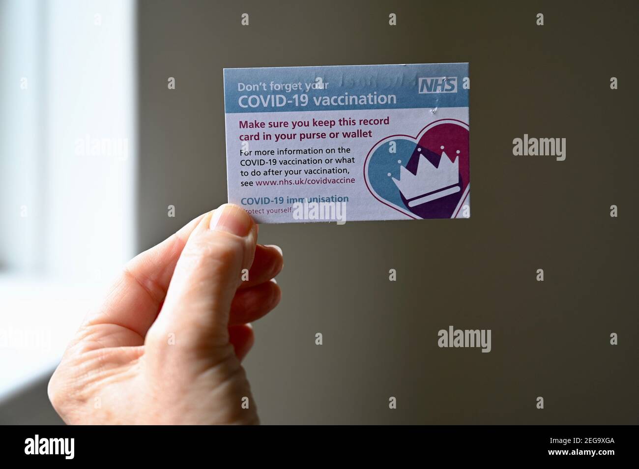 COVID-19 NHS Vaccination card Stock Photo - Alamy