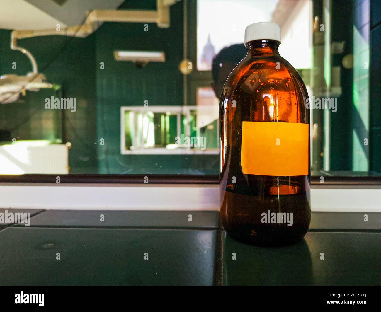 Empty bottle of syrup in old abandoned hospital Stock Photo - Alamy