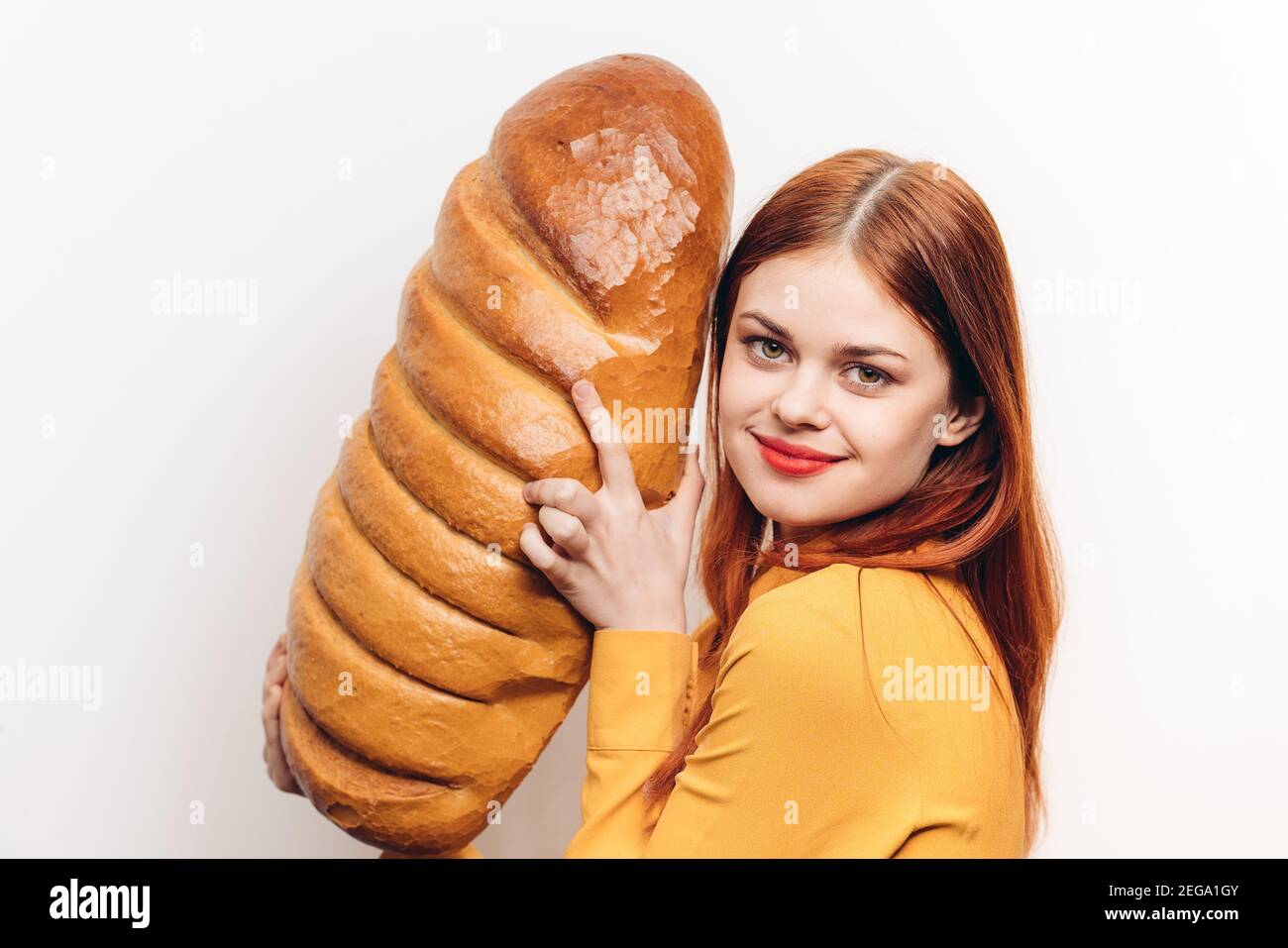 happy woman hugging loaf of bread flour product light background ...