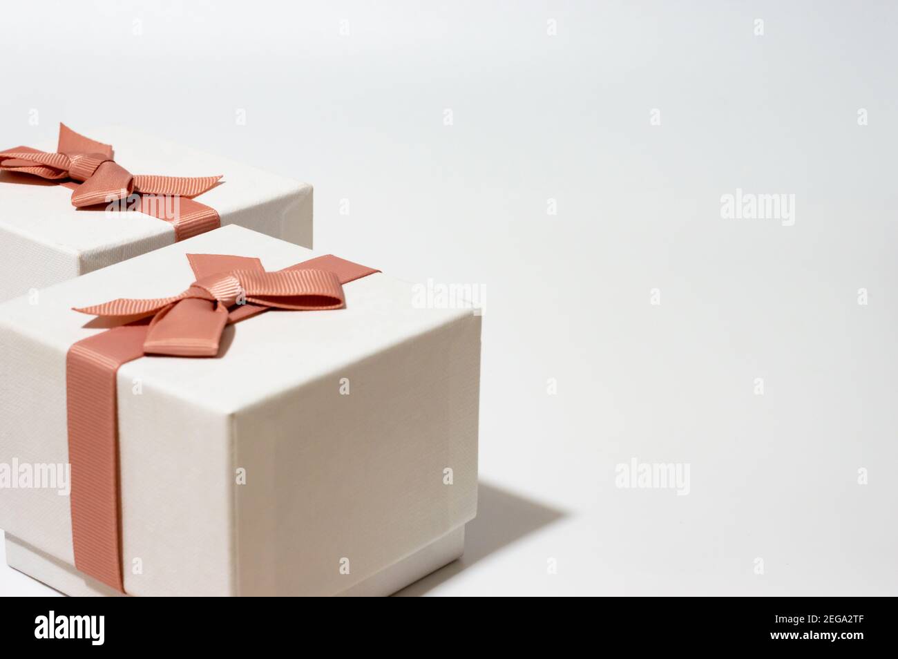 two white gift boxes on empty white background Stock Photo - Alamy
