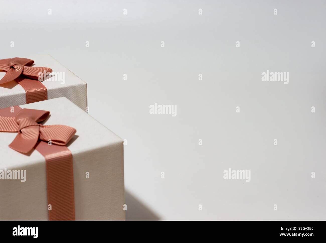 two white gift boxes on empty white background Stock Photo - Alamy