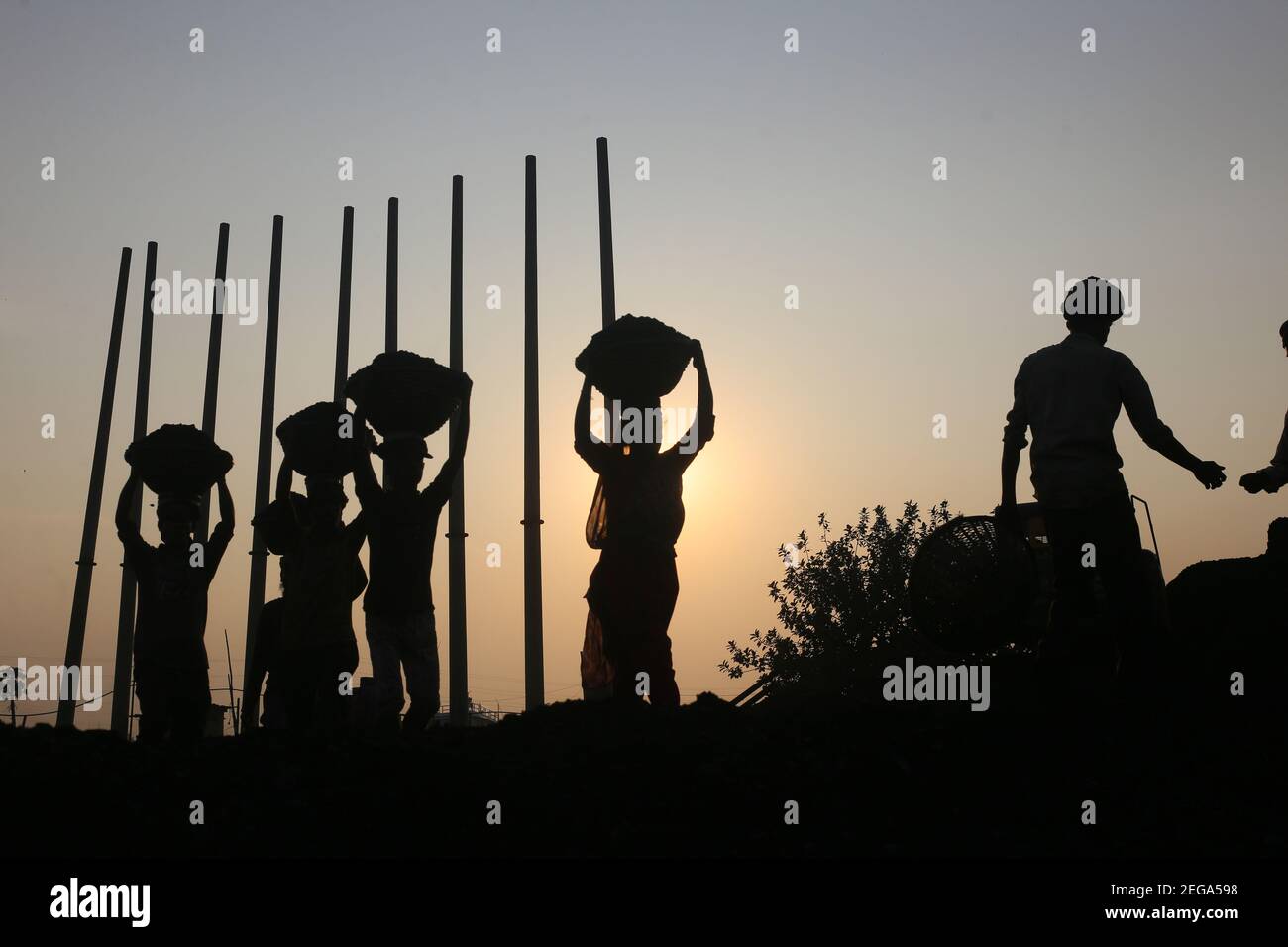 Dhaka, Bangladesh. 18th Feb, 2021. Day laborers silhouetted as they ...