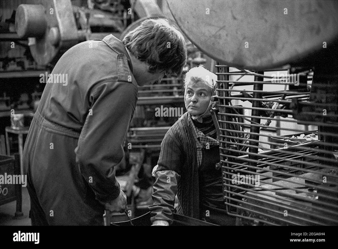 Engineer Talking to woman Machine operator in Wrench Factory Stock ...