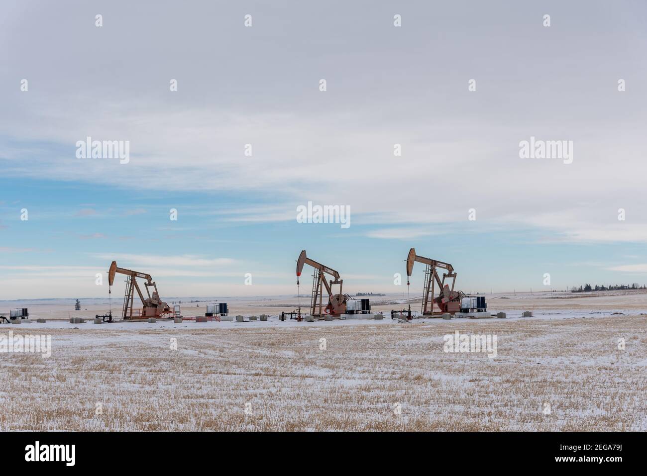 Oil pump on the prairies during winter Stock Photo - Alamy