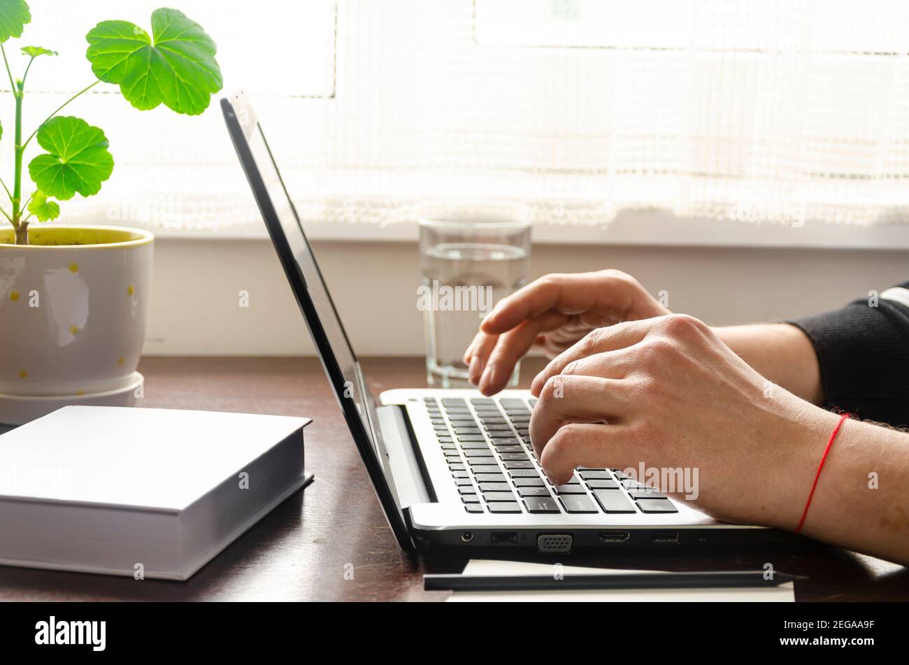 Freelancer's workplace at a table near the window. Home office Stock ...