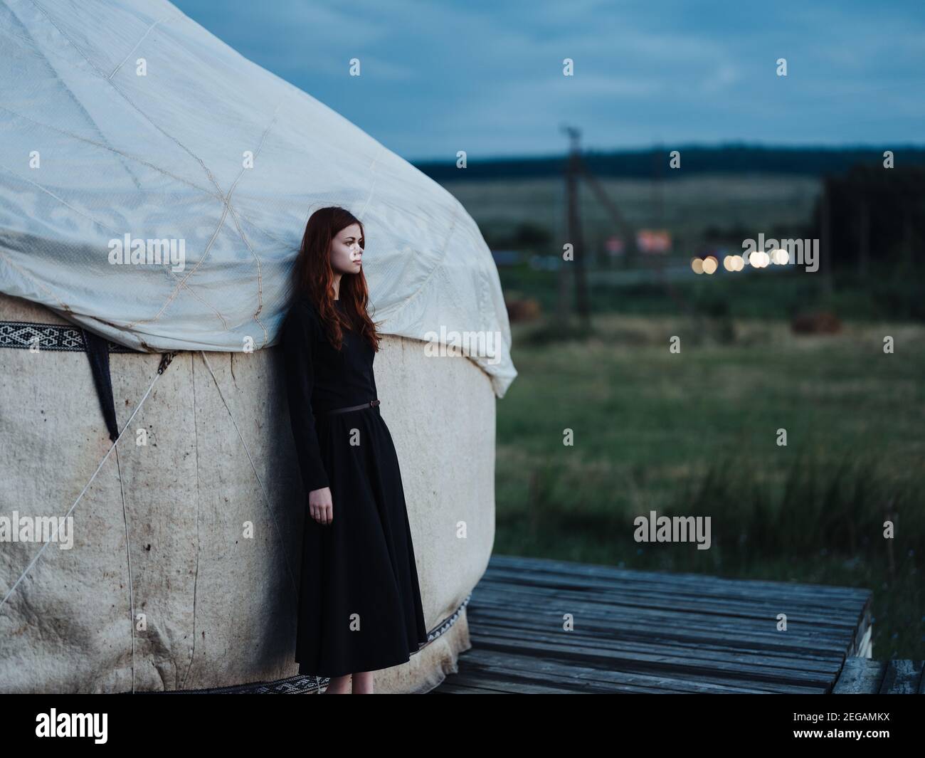 A woman in a dress near the traditional Mongolian dwelling yurt Stock ...