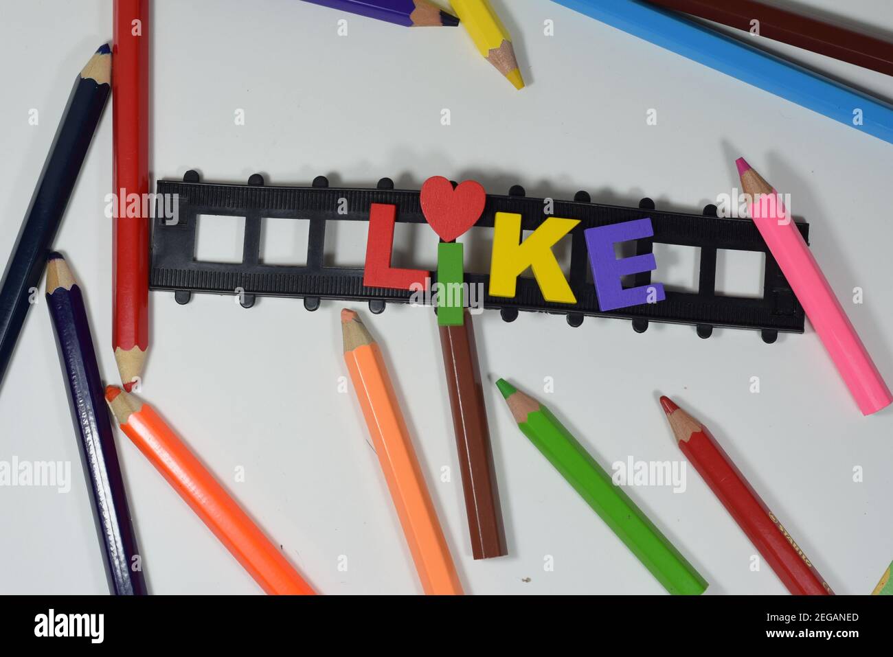 LIKE Colourful wording and Colour Pencils Isolated With White ...