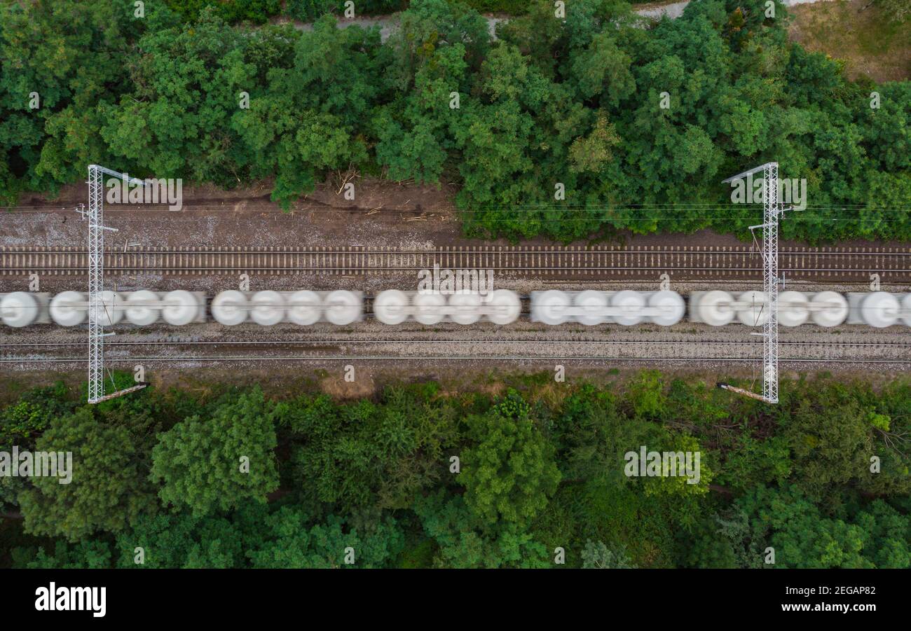 Top down aerial look to driving goods train between trees Stock Photo ...