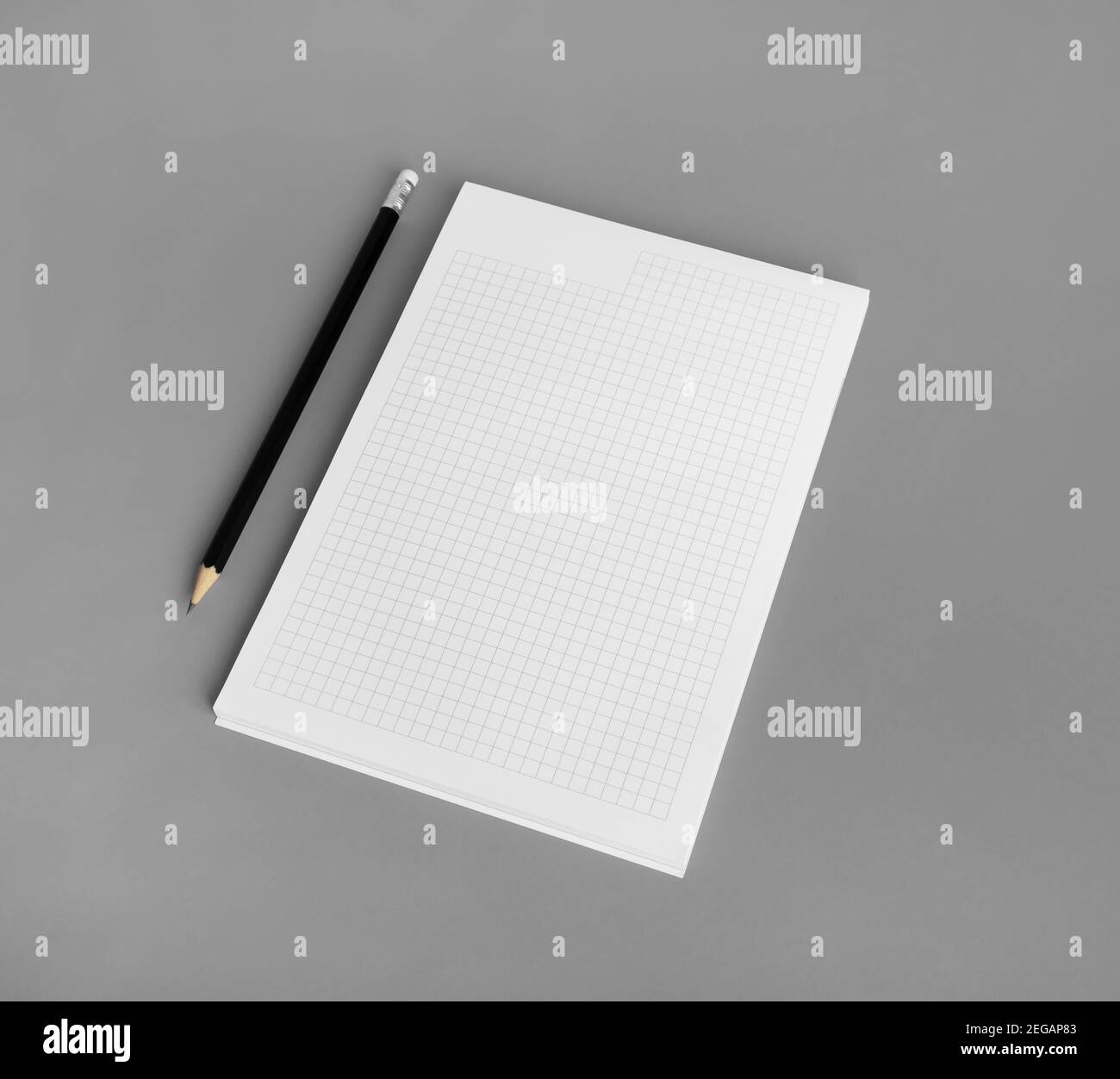 Blank notepad and pencil on gray paper background. Branding identity ...